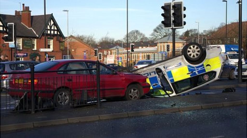 Greater Manchester Police car overturns on 999 call - BBC News