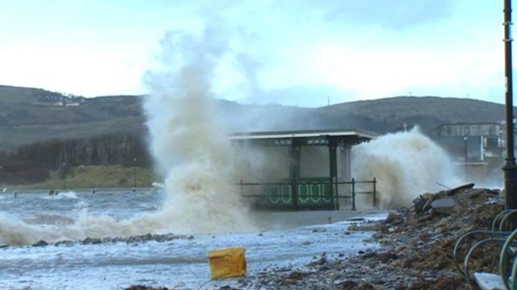 Storm surge brings flooding chaos moving up Wales' coast - BBC News