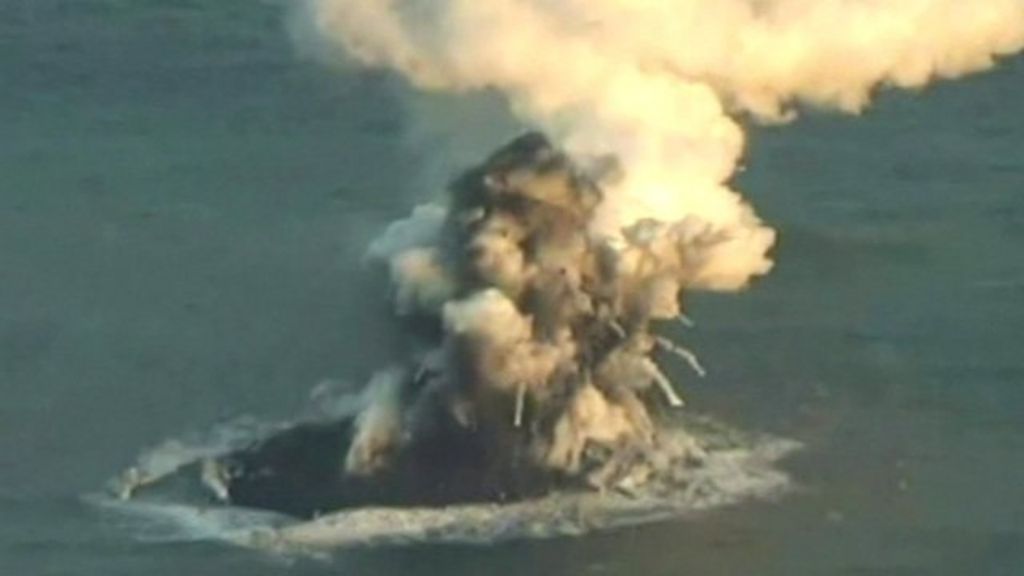 Japan's new island grows in size after volcanic eruption - BBC News