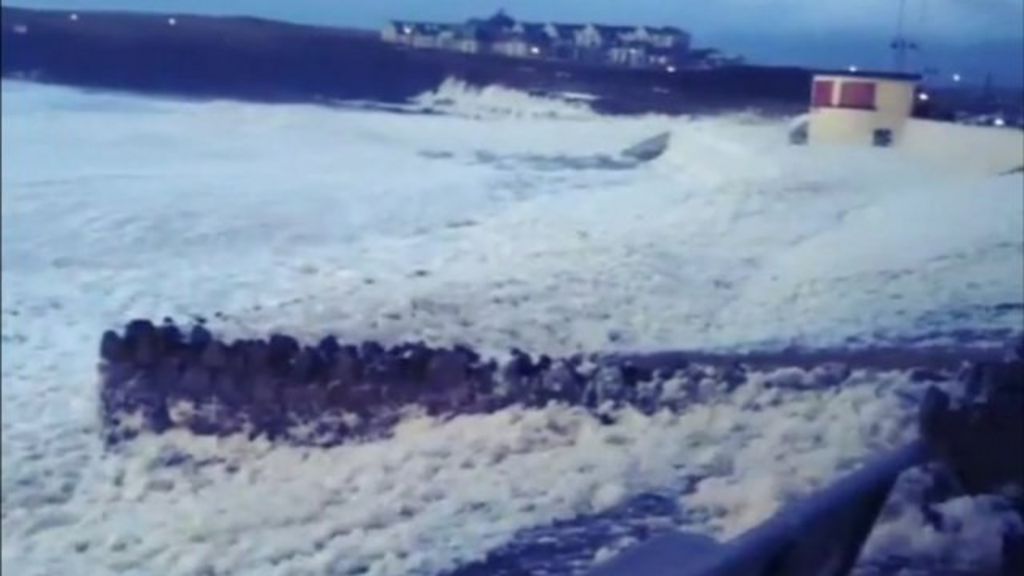 Donegal beach submerged in foam after storm - BBC News
