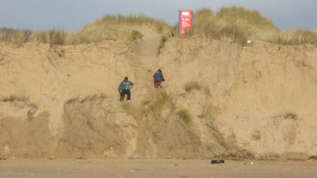 Cefn Sidan sand dune cliff collapse warning after storms - BBC News