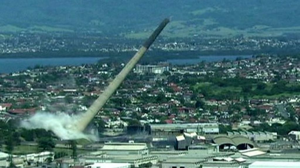 Australian chimney demolished in controlled explosion - BBC News