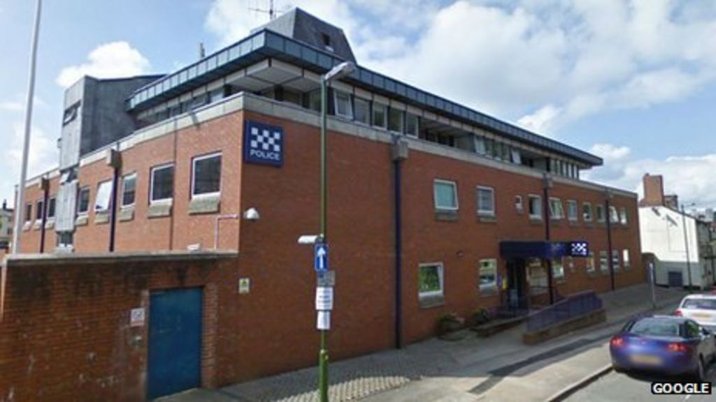 Man held over Leek police station roof climb - BBC News