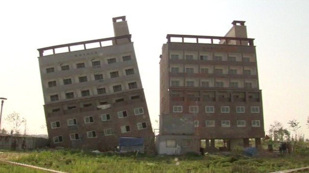 South Korean building under construction tilts to one side - BBC News