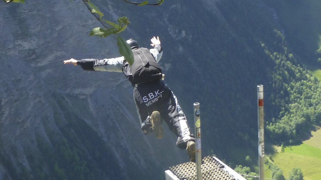 The girls base jumping off cliffs in the Swiss Alps - BBC News