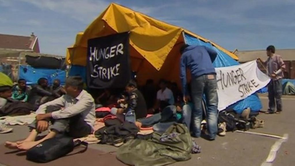 Scores of migrants in Calais on hunger strike protest - BBC News