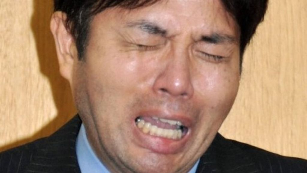Japanese politician Ryutaro Nonomura sobs at news briefing - BBC News
