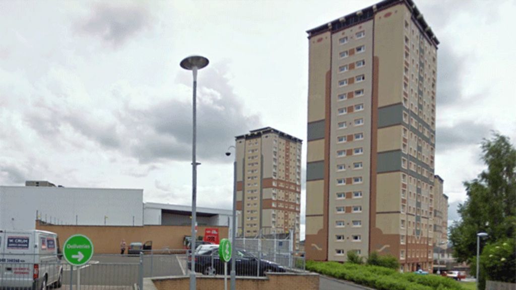 Residents return to Motherwell asbestos scare tower block - BBC News