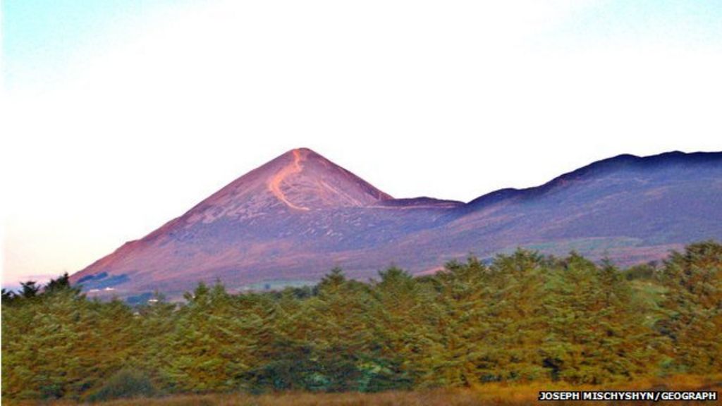 Thousands scale Croagh Patrick in Irish holy mountain climb - BBC News