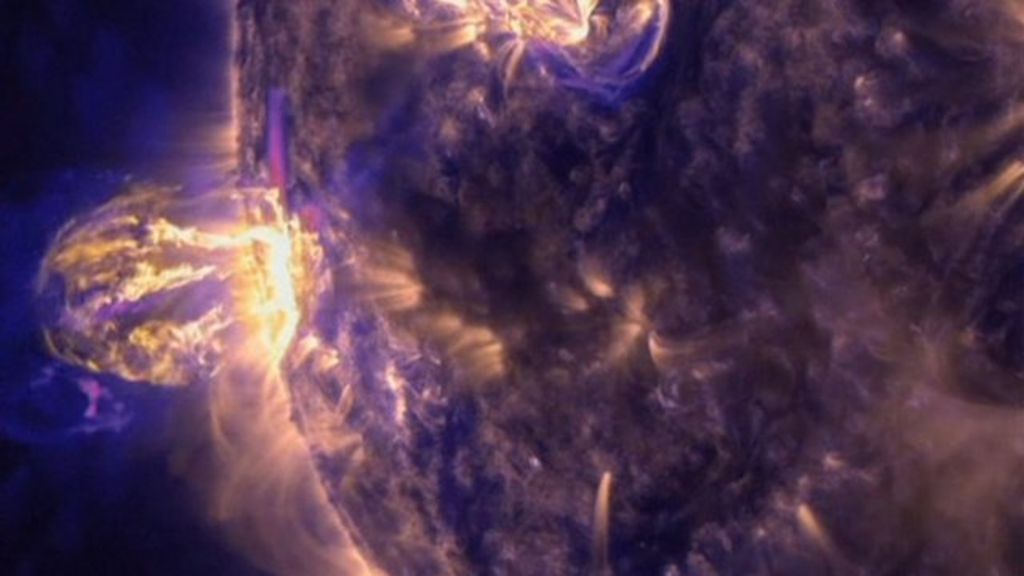 Nasa release footage of powerful solar flares - BBC Newsround