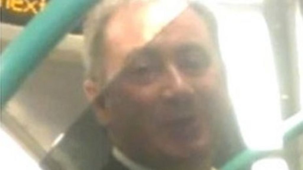 Banker Neil Docherty admits racist abuse on train - BBC News