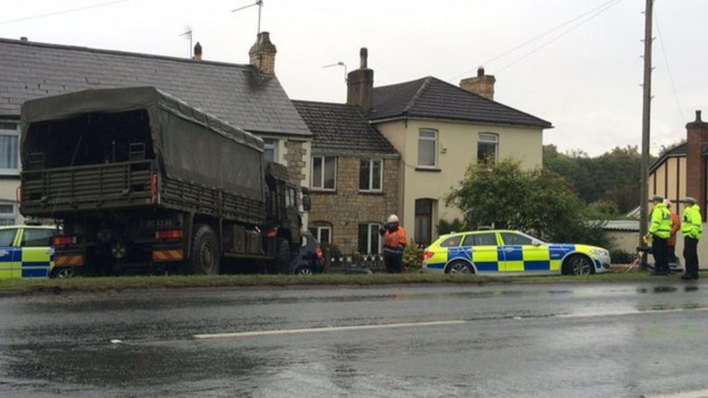 Pensioner's car hits house after army lorry collision - BBC News