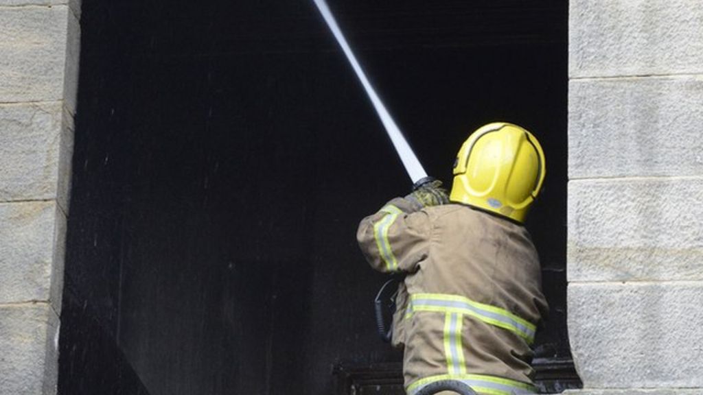 Firefighters hurt in ceiling collapse after arson attack - BBC News
