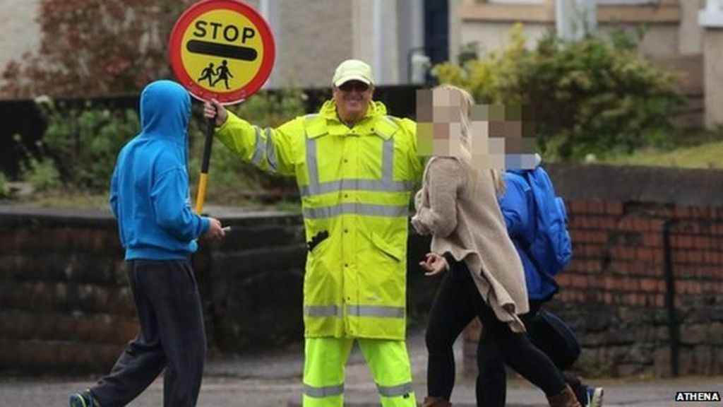People power persuades lollipop man back to Cardiff school - BBC News