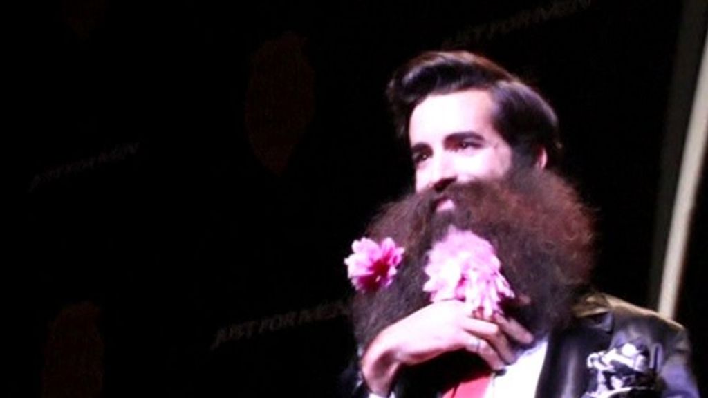 Beard championship winner celebrates with flowers - BBC News