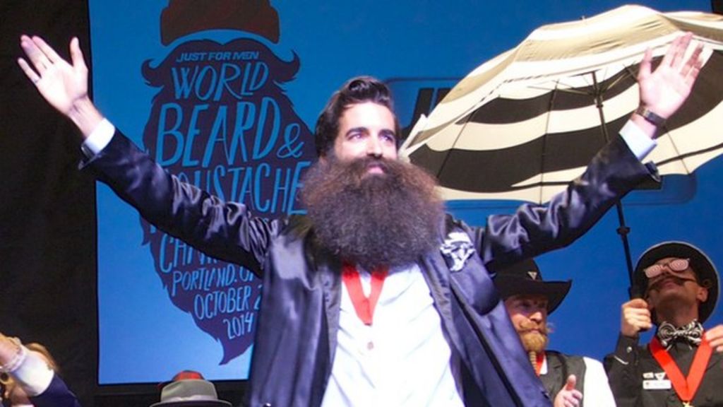 Beard championship winner celebrates with flowers - BBC Newsround