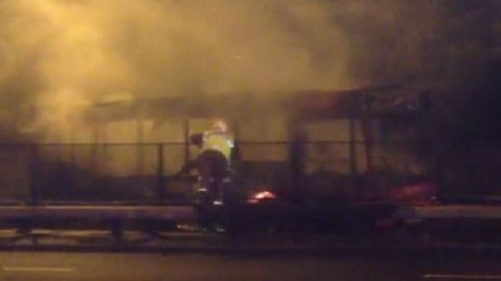 Bus catches fire after collision with car in Barnet - BBC News
