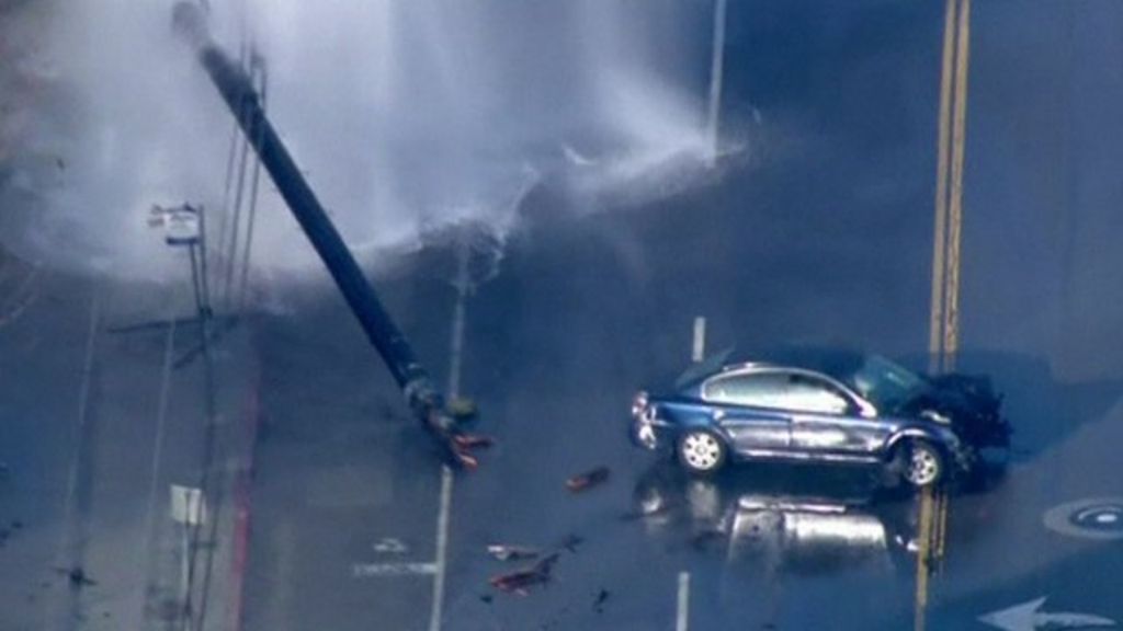 California car crash causes fire hydrant geyser - BBC News