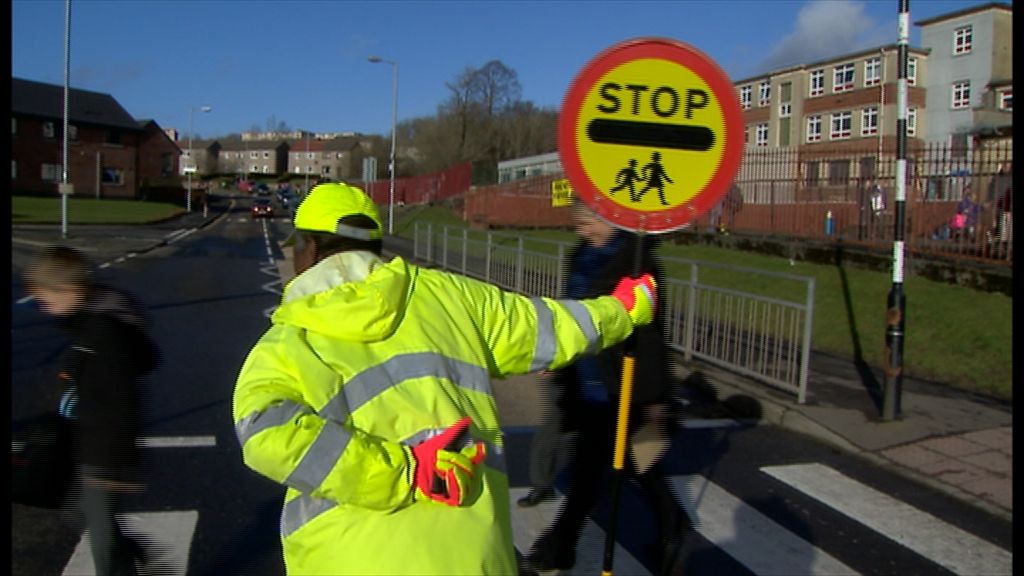 Lollipop man banned from high-fiving - BBC News