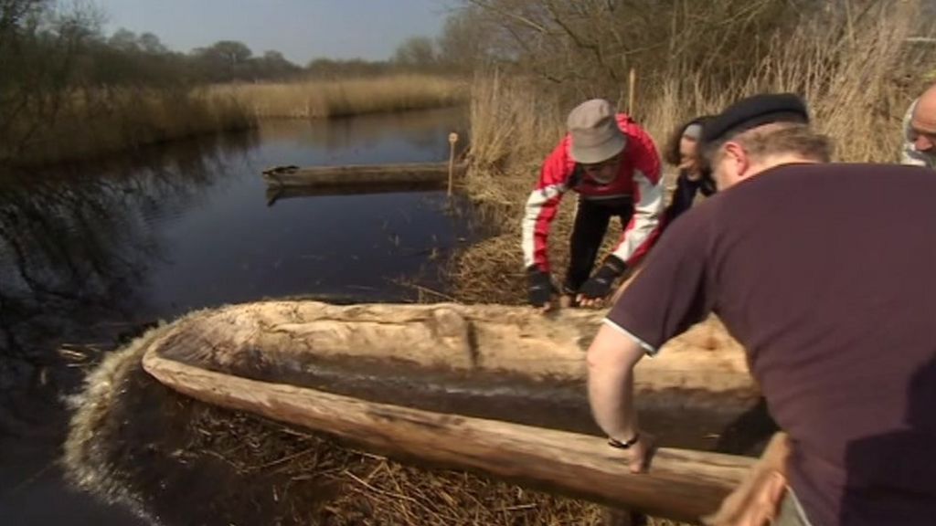 Replica Iron Age canoes launched on Avalon Marshes - BBC News