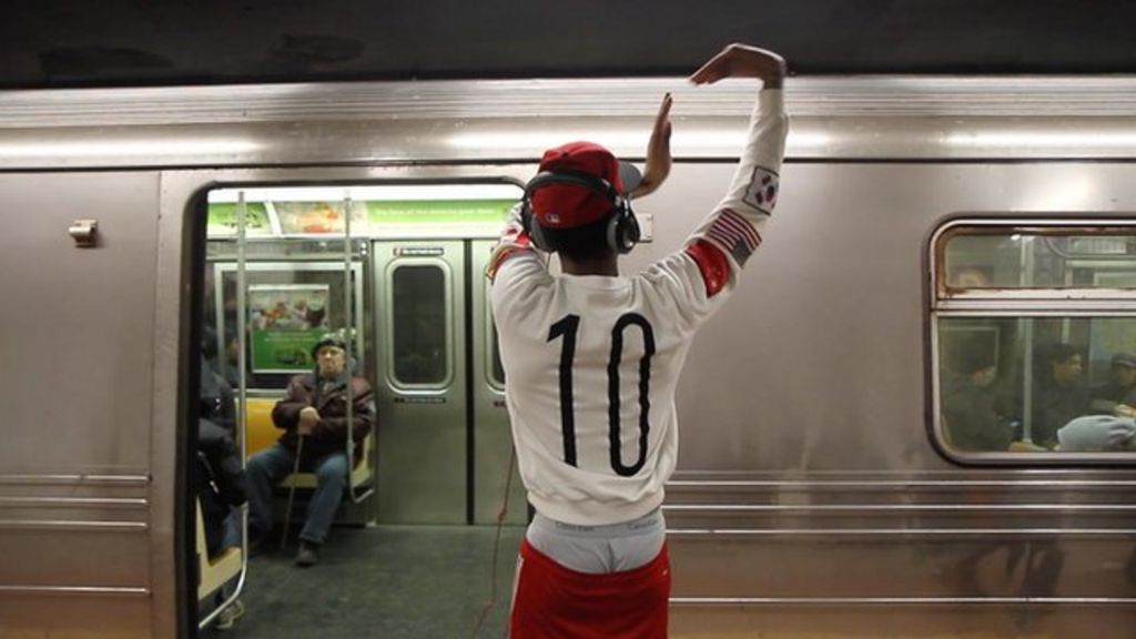 Dancers perform on New York's subway despite arrest threat - BBC News