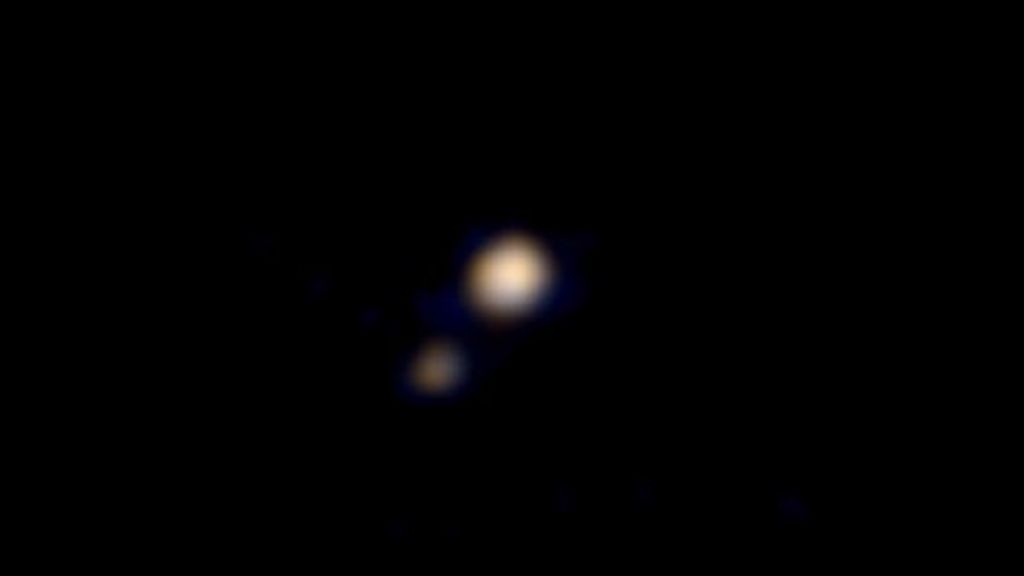 Coloured Pluto comes into view - BBC News