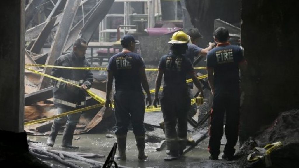 Scores killed in Manila factory fire - BBC News