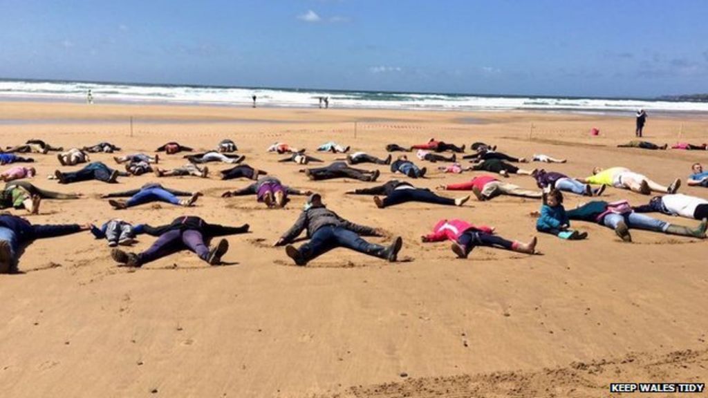 400 people attempt sand angels world record in Pembrokeshire - BBC News