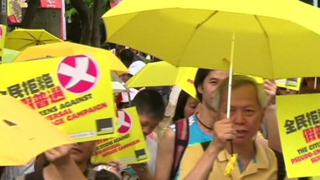 Hong Kong democracy campaigners take to streets - BBC News
