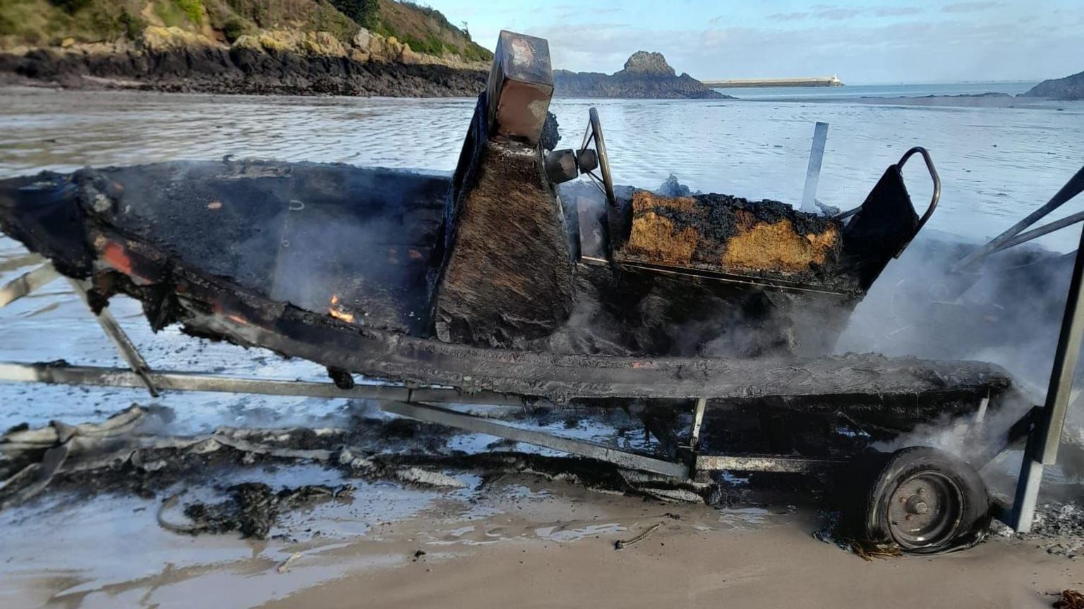 Man treated for burns after boat catches fire in Jersey bay - BBC News