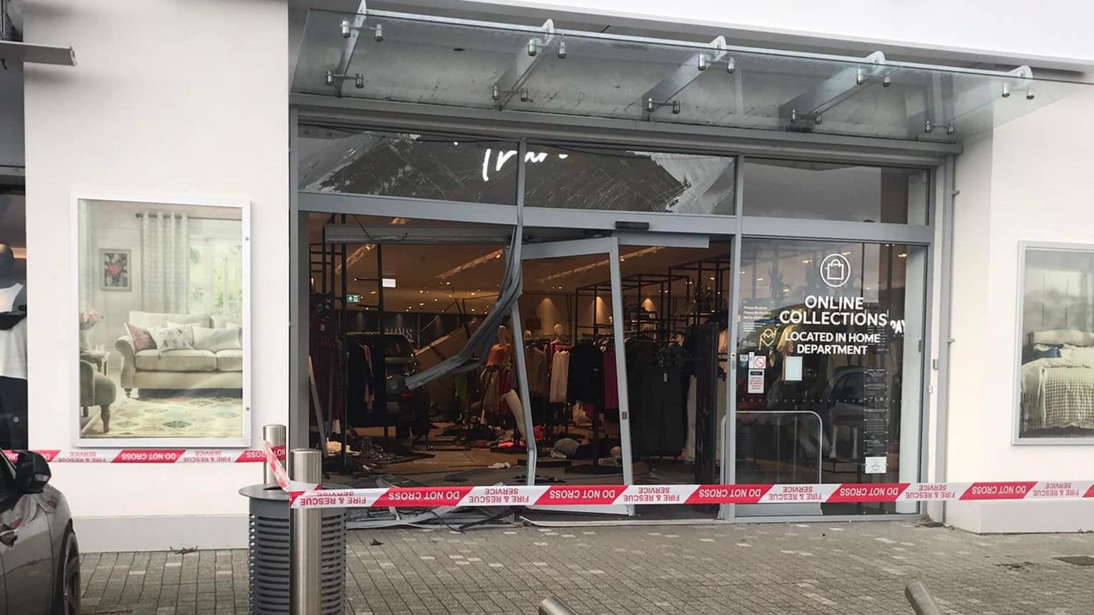 Car crashes through Next store doors in Truro, Cornwall - BBC News