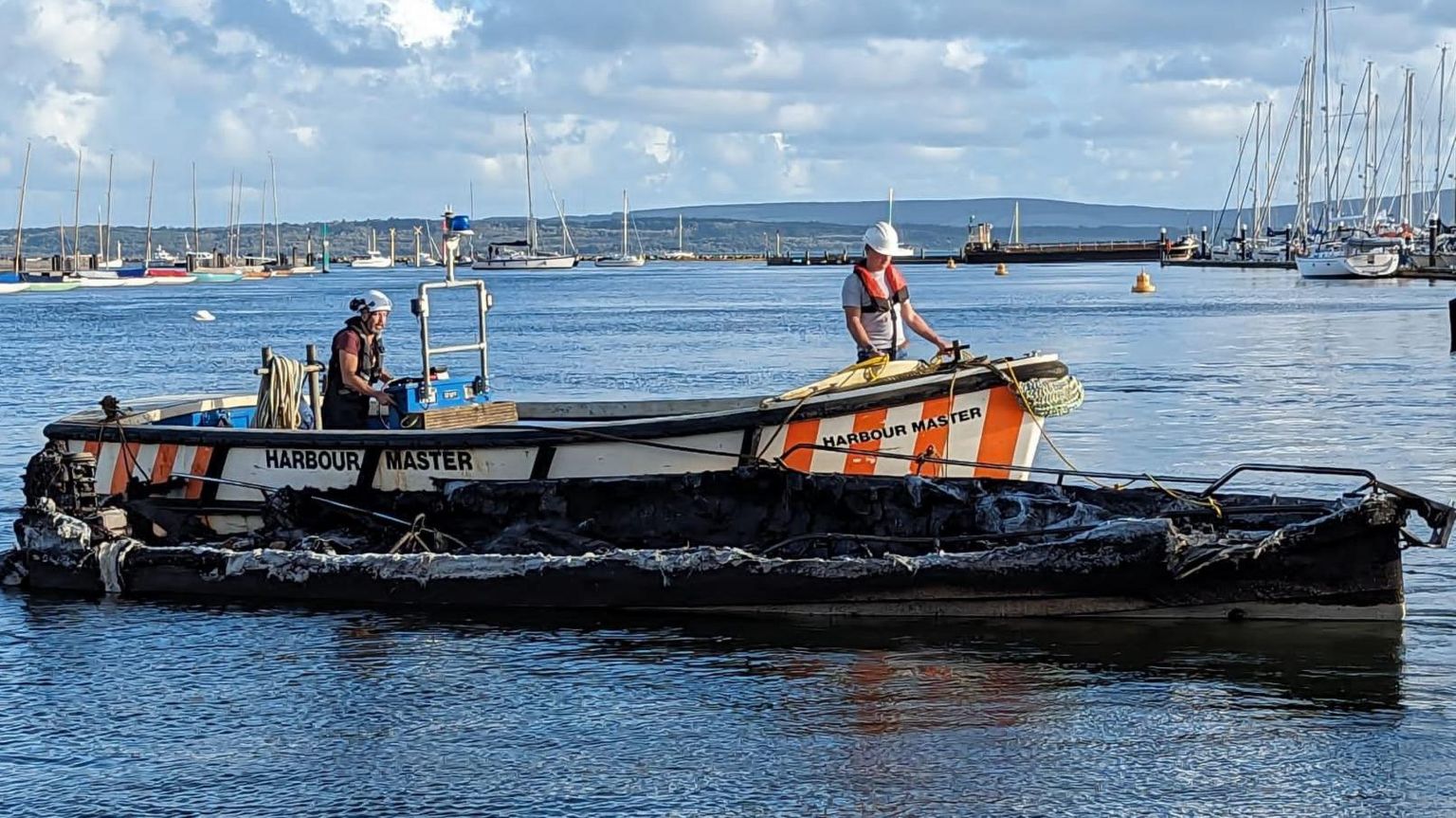 Lymington: Two rescued from boat destroyed by fire - BBC News
