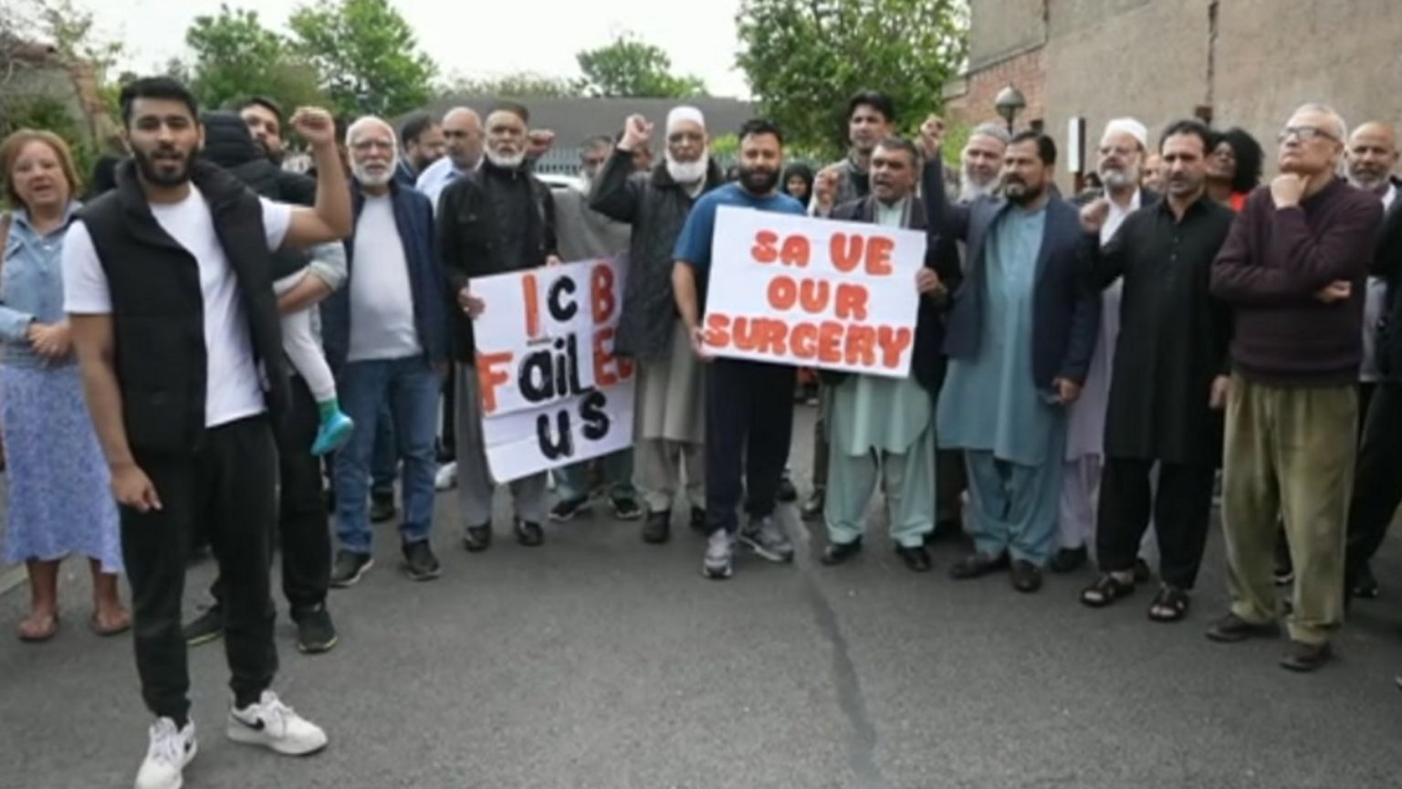 Protest after Burton GP surgery relocated to two sites - BBC News