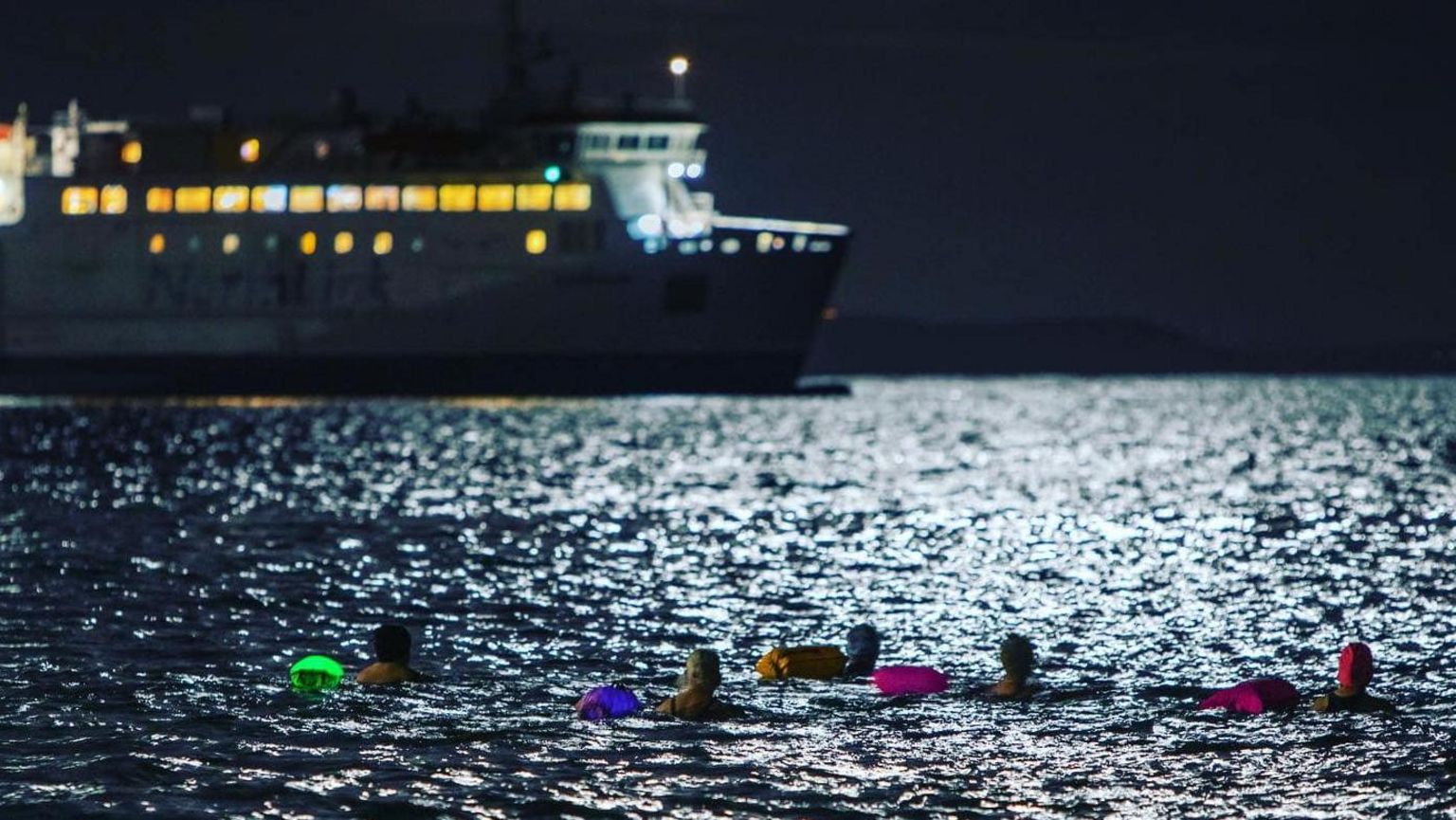 In pictures: Caithness' winter night swimmers - BBC News