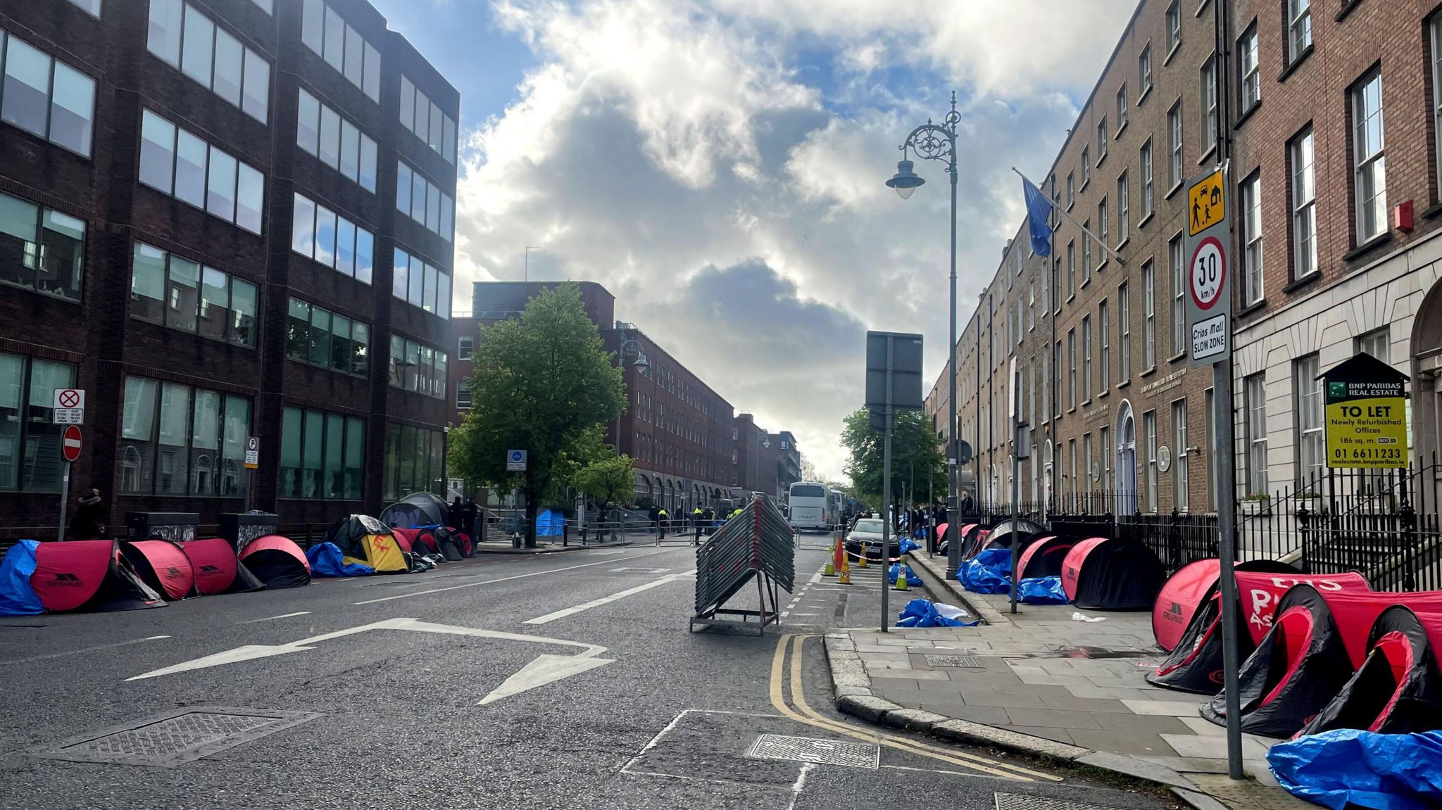 Dublin asylum seekers say new tented accommodation flooded - BBC News