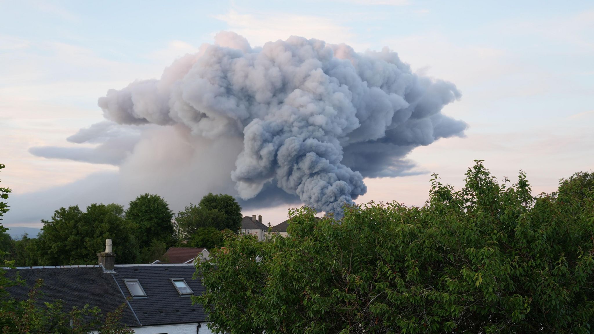 Huge plume of smoke as firefighters tackle industrial site blaze - BBC News