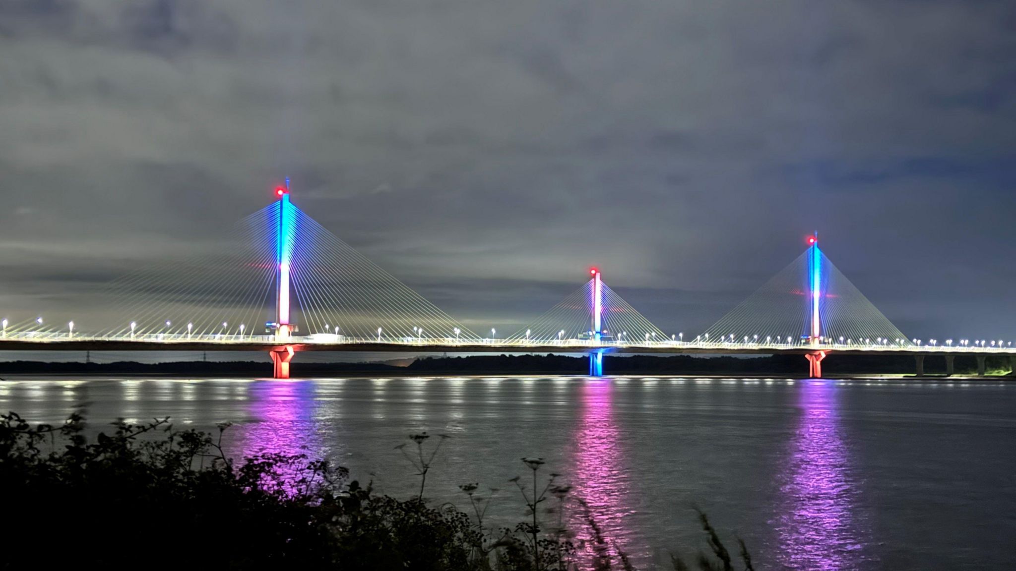 Mersey Gateway Bridge lit up blue and orange for MND - BBC News