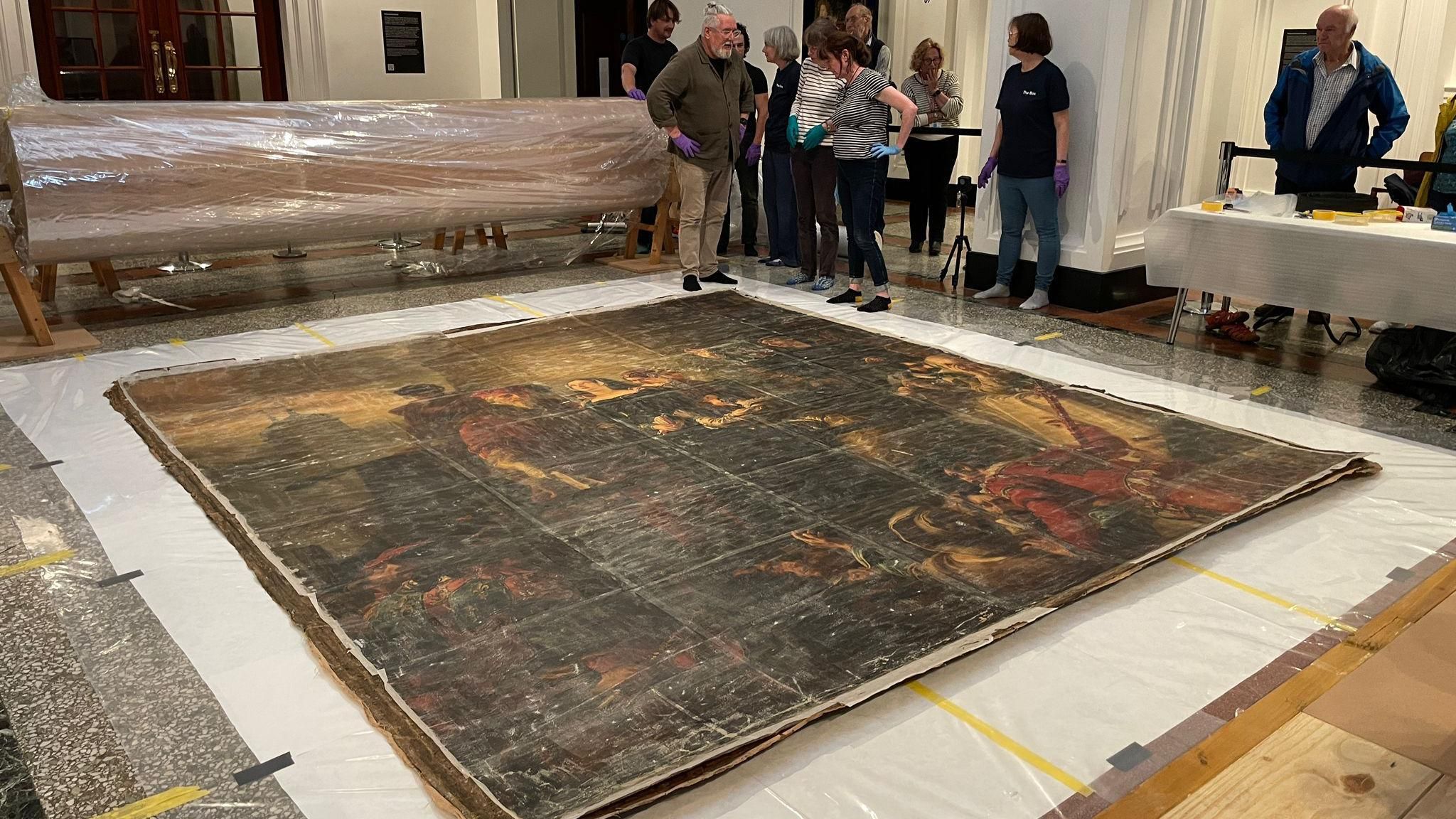 Artwork unrolled in Plymouth after a century in storage - BBC News