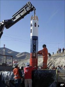 Chile miners: Family joy as rescue capsule arrives - BBC News