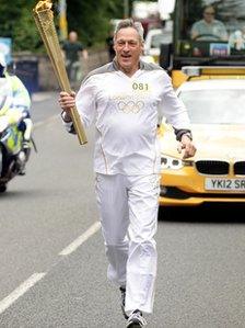 Olympic torch: Allan Wells carries flame in Borders - BBC News
