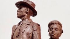 Windrush Day: Queen praises pioneers as Waterloo statue unveiled - BBC News