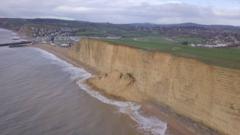 Jurassic Coast rockfall cuts off access to West Bay beach in Dorset ...