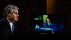 Capitol riot 'inspiration for extremism', FBI boss warns - BBC News