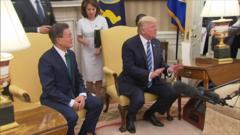 Donald Trump posts video clip of him 'beating' CNN in wrestling - BBC News