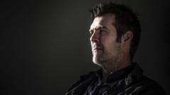 Comedian Rhod Gilbert stands up to shyness - BBC News