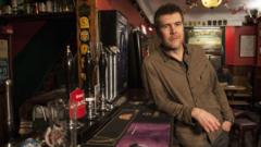 Comedian Rhod Gilbert stands up to shyness - BBC News