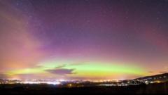 Northern Lights shine in the night sky over Wales - BBC News