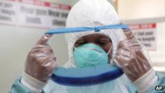 Ebola fear: 'Having a small fever makes you very afraid' - BBC News