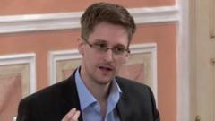 Edward Snowden hits out at critical report into his activities - BBC News