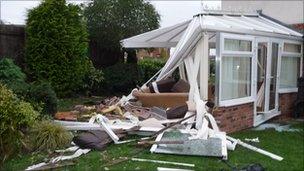 Barrier plea after car hits couple's conservatory - BBC News